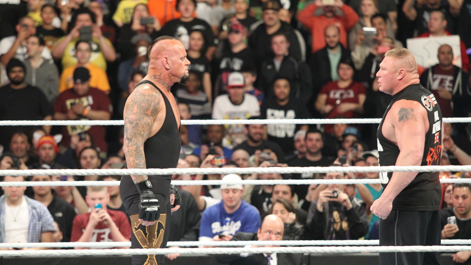 WWE Raw: The Undertaker rises from a coffin to frighten Brock Lesnar in ...